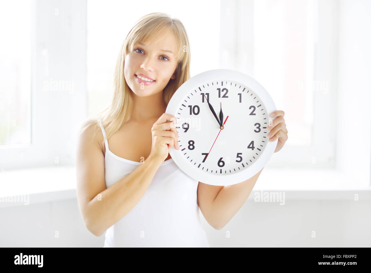 Teacher with clock hi-res stock photography and images - Alamy