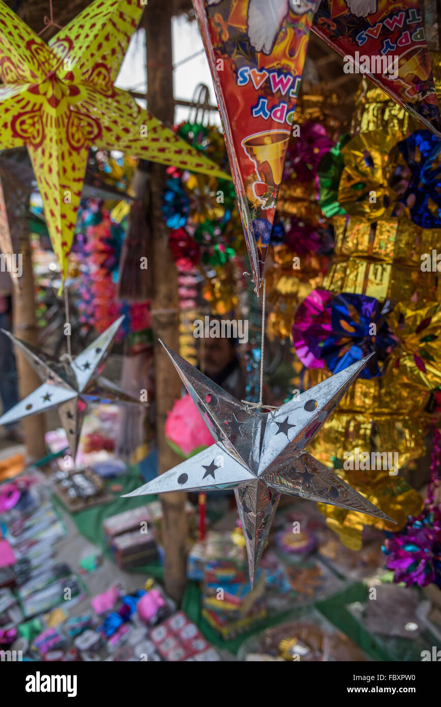Indian market. Vibrant paper and foil Christmas decorations and stars ...
