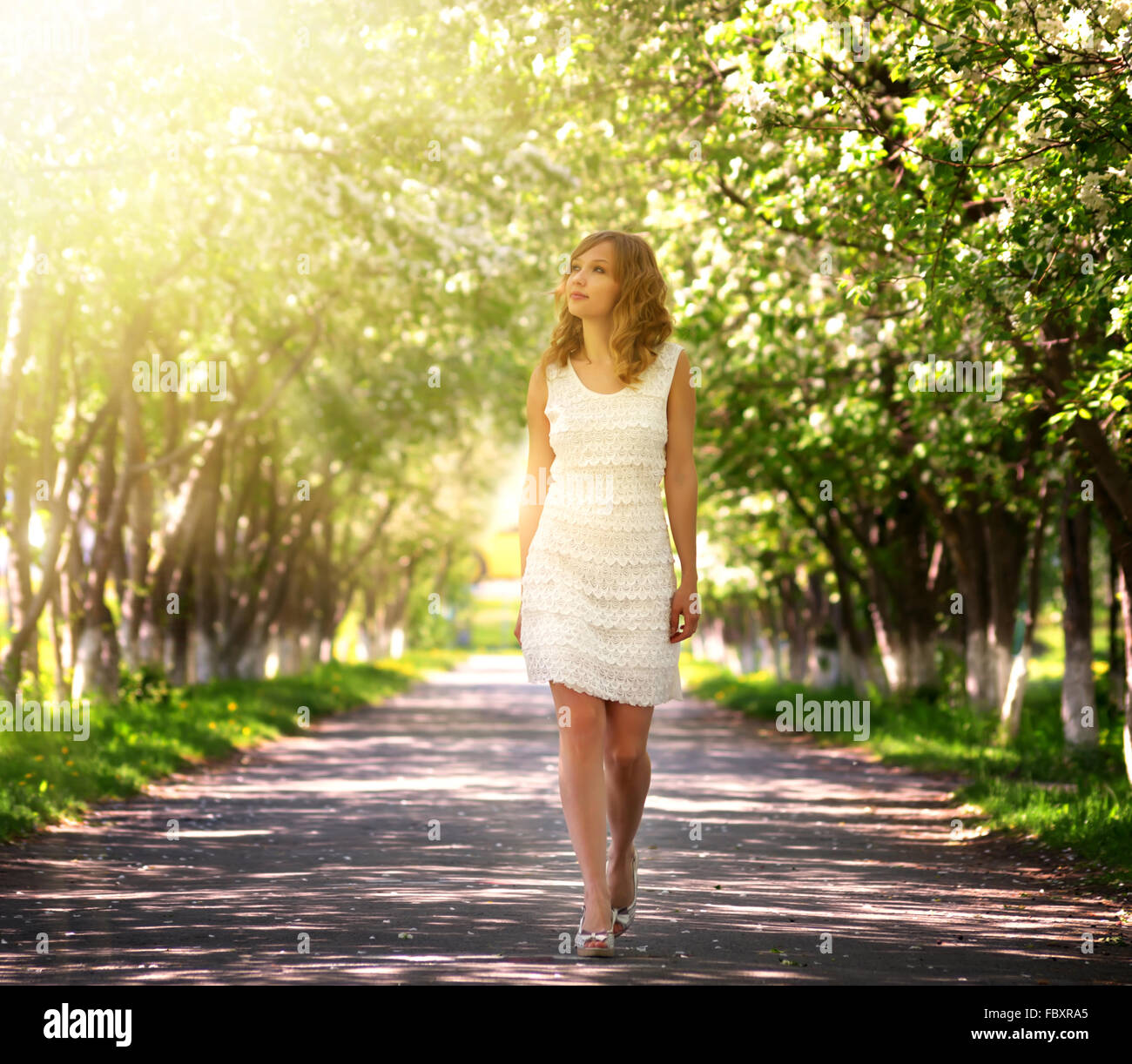 Girl walking in the park Stock Photo - Alamy