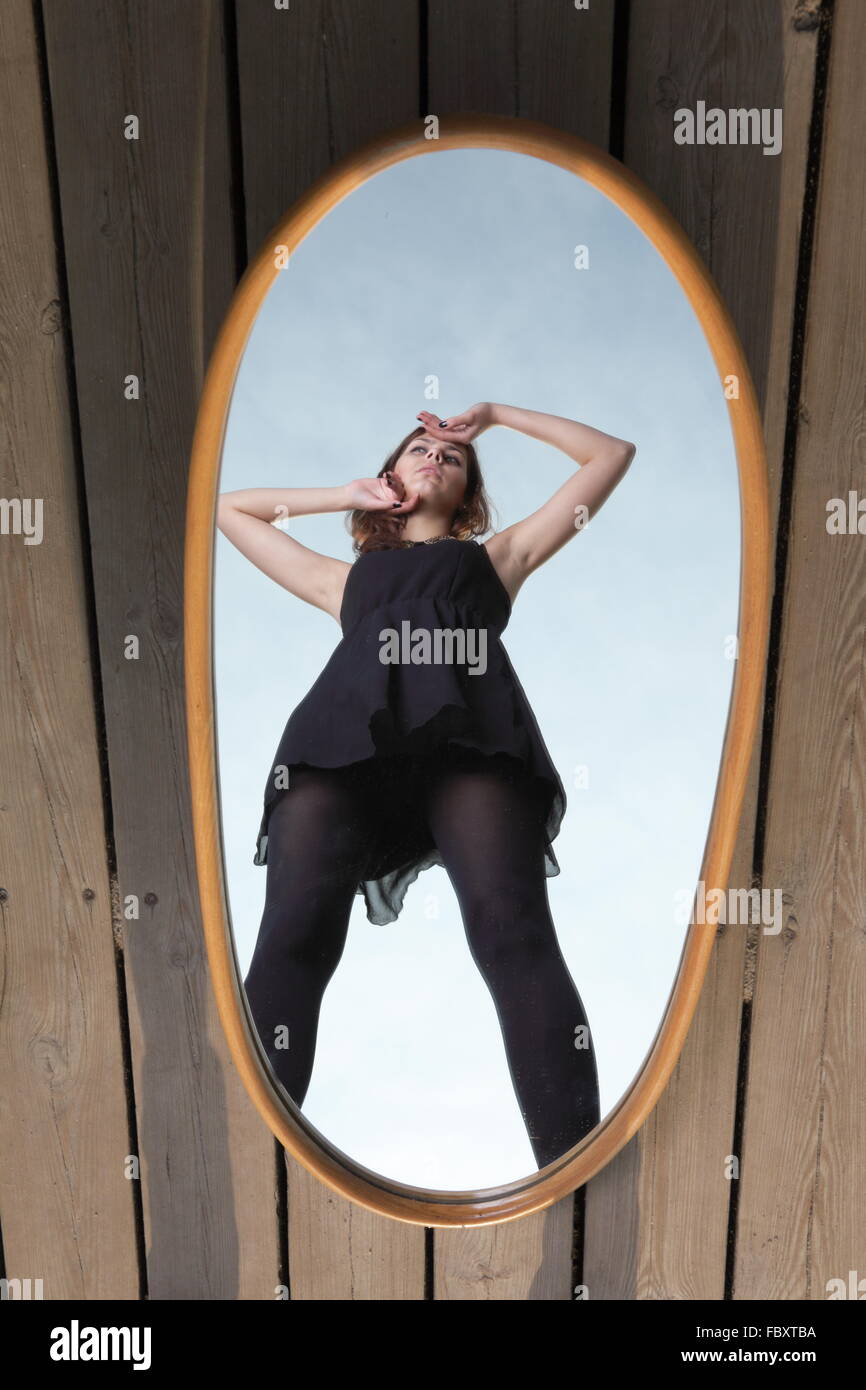 thoughtful woman with her reflection in mirror Stock Photo - Alamy