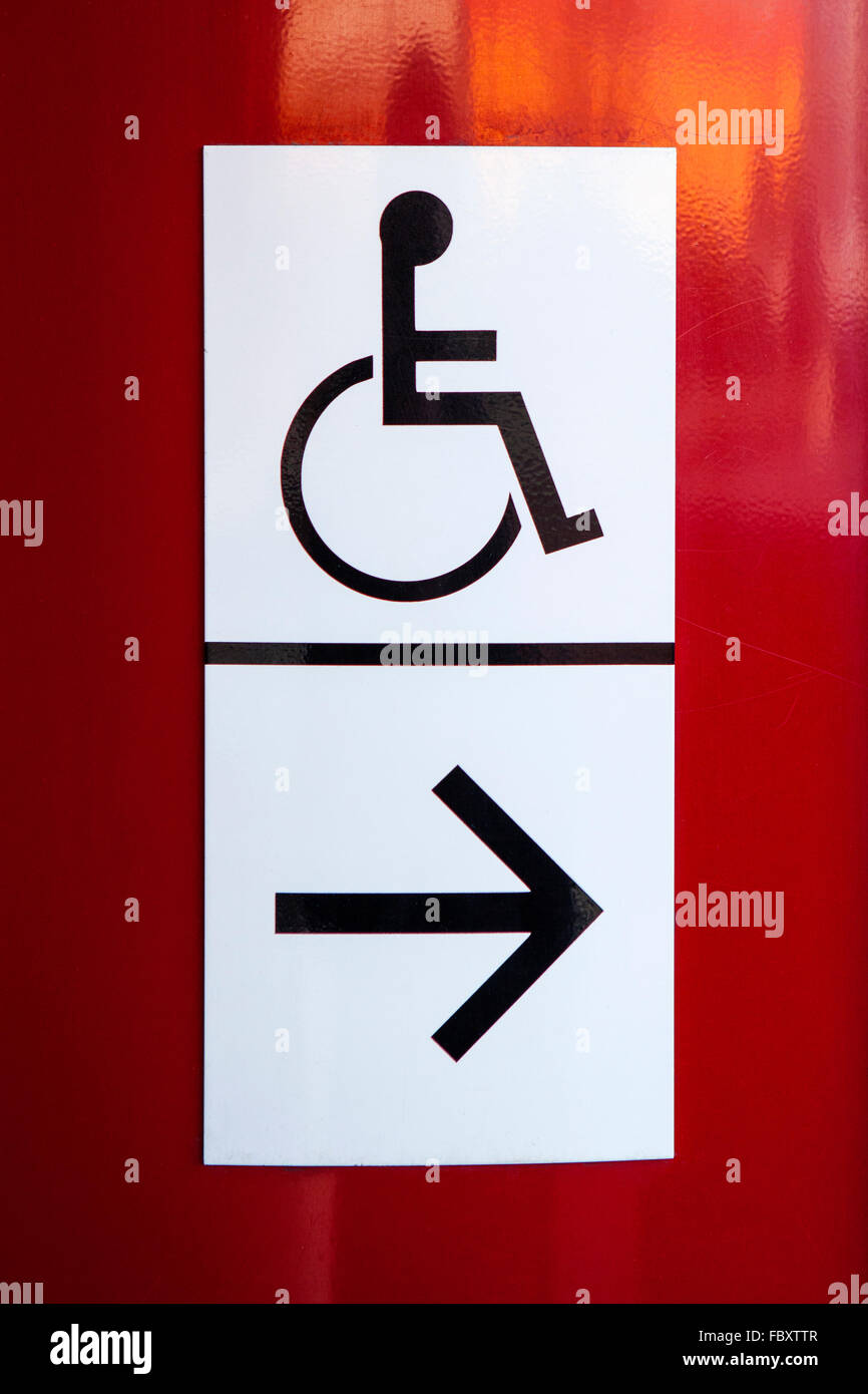A sign notifying the nearest Disabled facilities and access Stock Photo ...