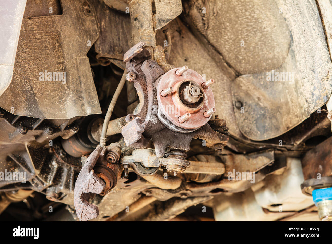 Car in service. Detail of the wheel assembly on automobile Stock Photo ...