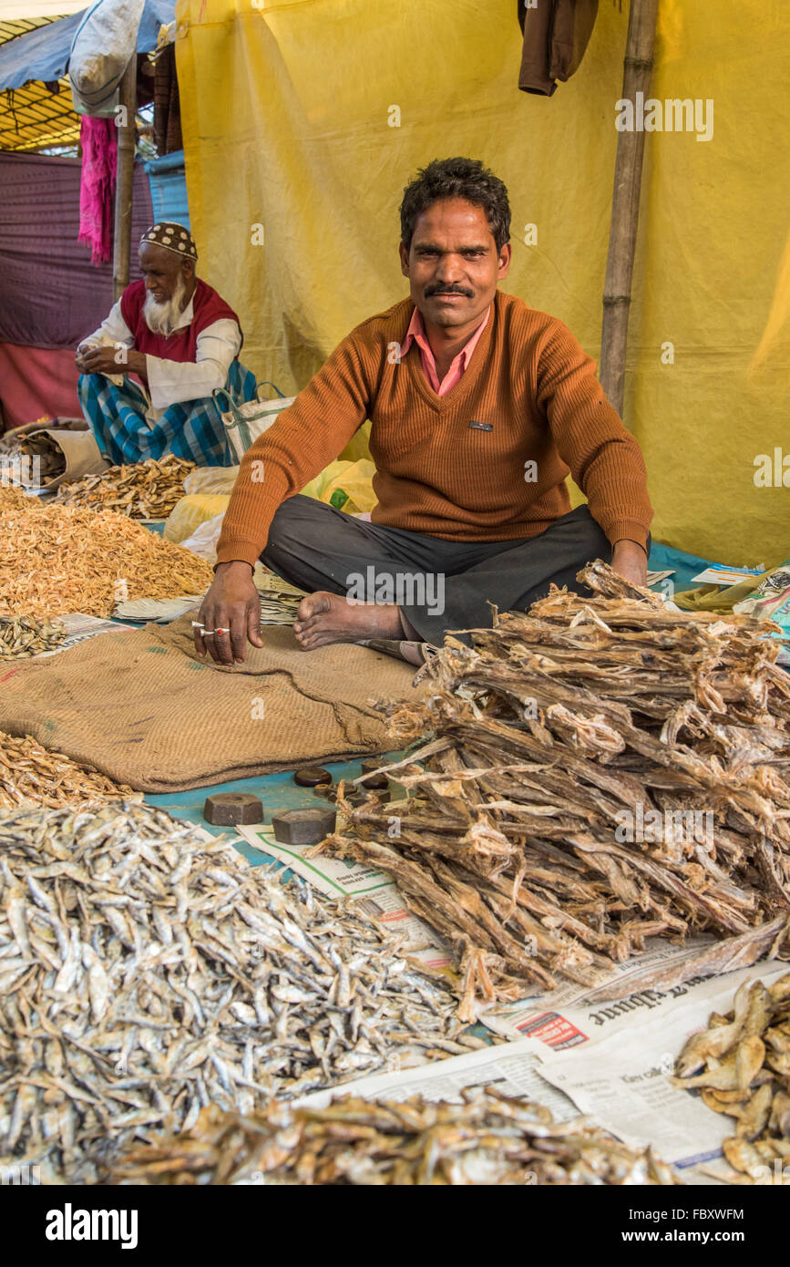 Indian market. Two seated male market traders selling assorted dried ...