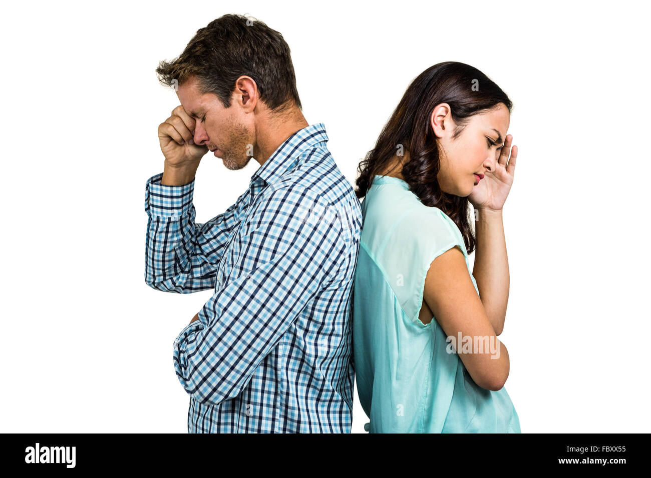 Depressed couple standing back to back Stock Photo - Alamy