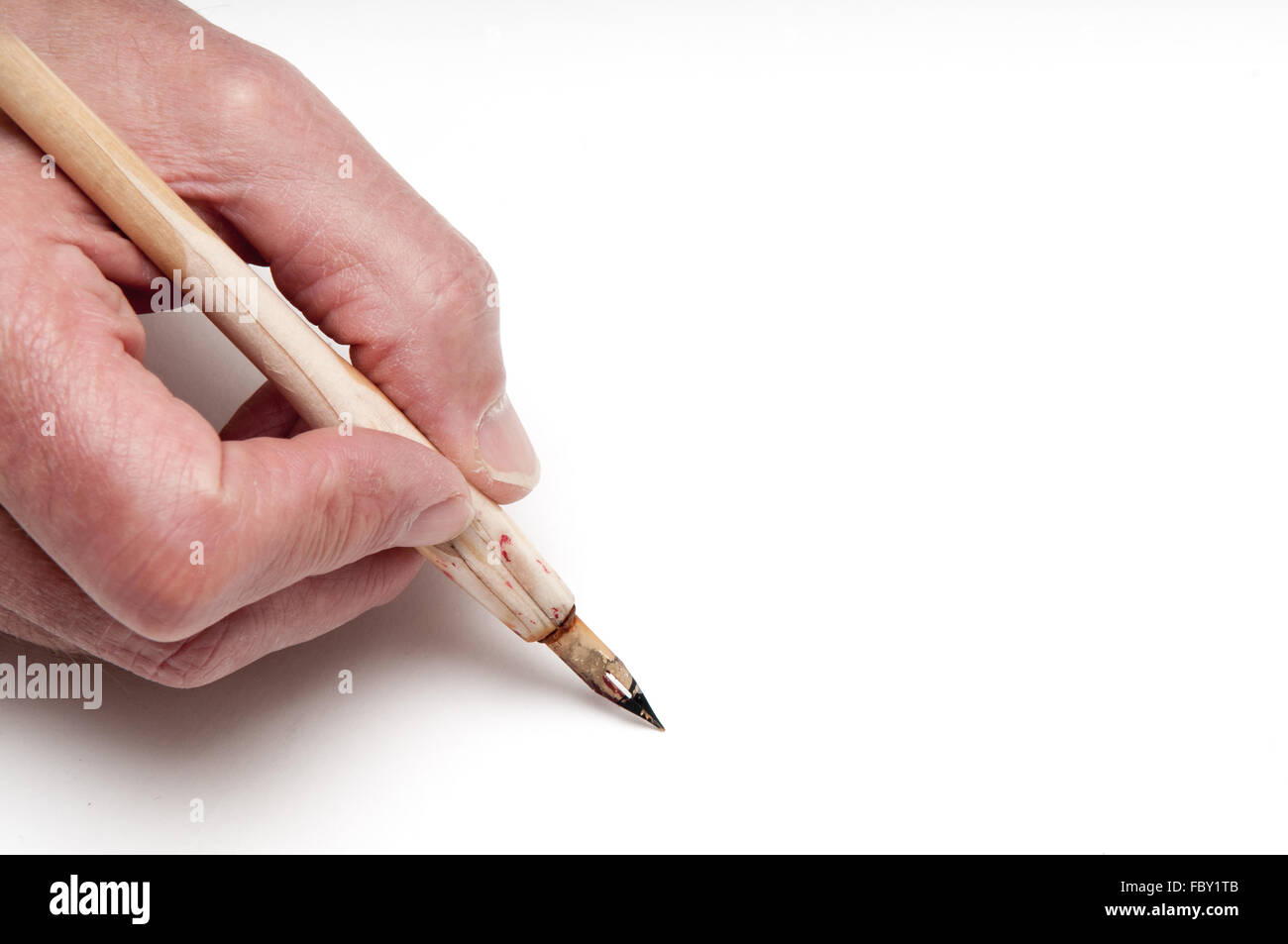 Man holding a calligraphy brush with space to add text Stock Photo - Alamy