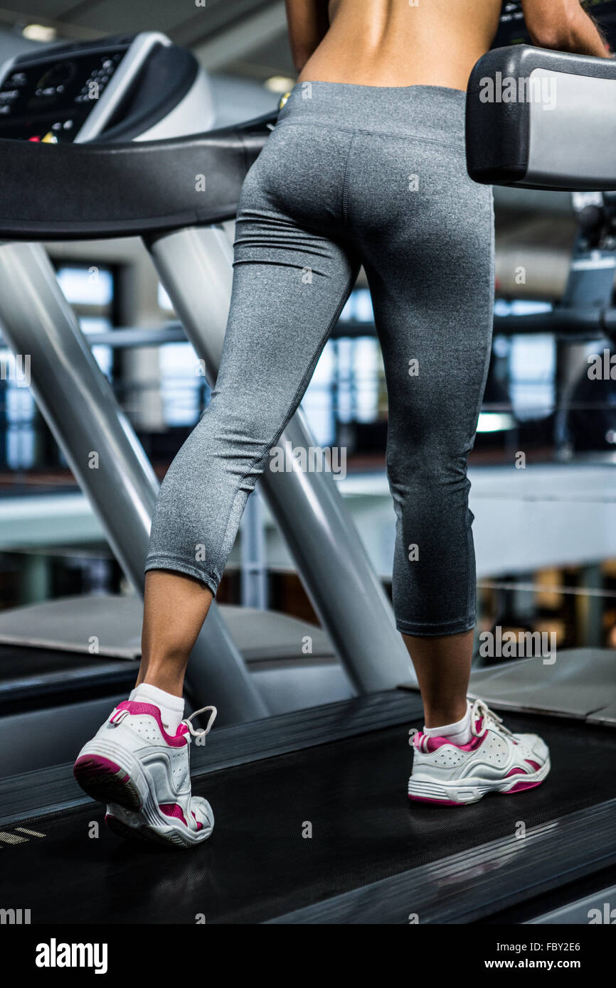 Mid section of woman using treadmill Stock Photo - Alamy