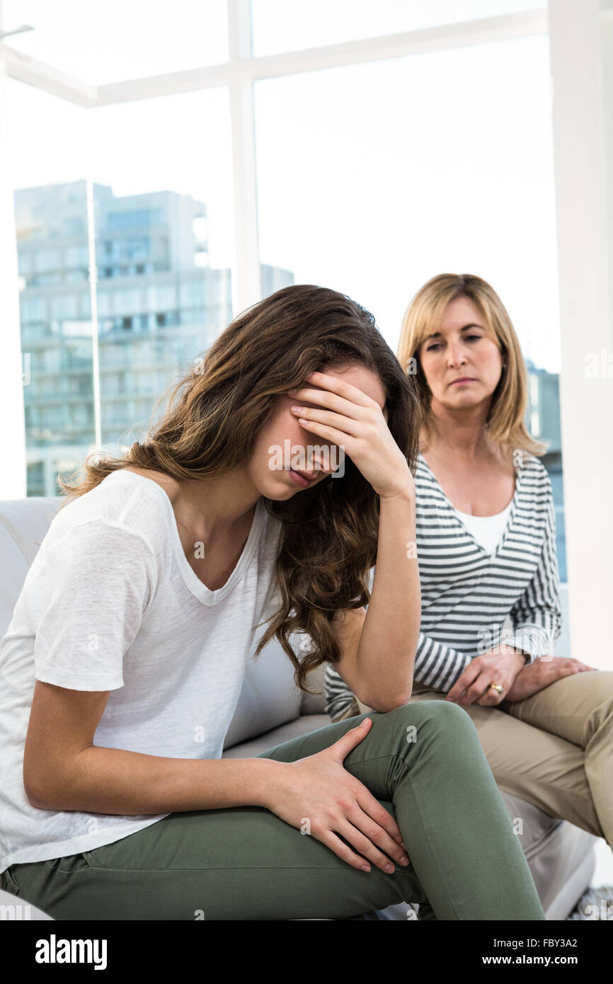 Sad daughter against mother Stock Photo - Alamy