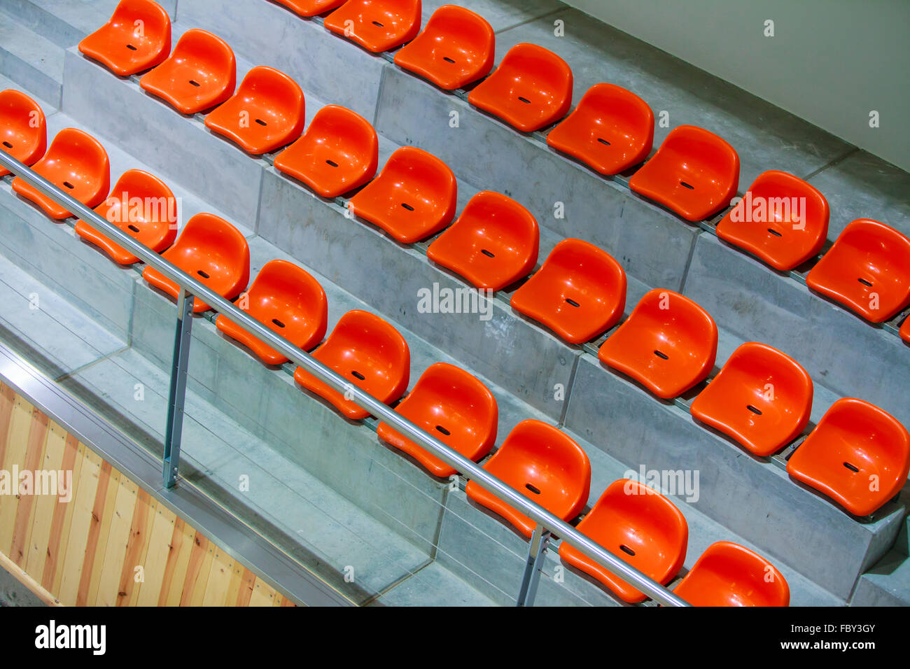Closeup of red sport stadium seats. Empty stand. Team sport supporter ...