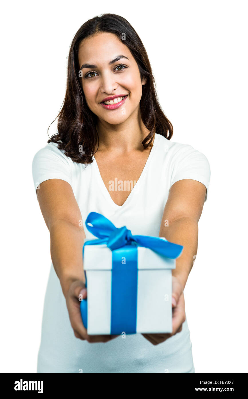 Portrait of young woman giving gift box Stock Photo - Alamy