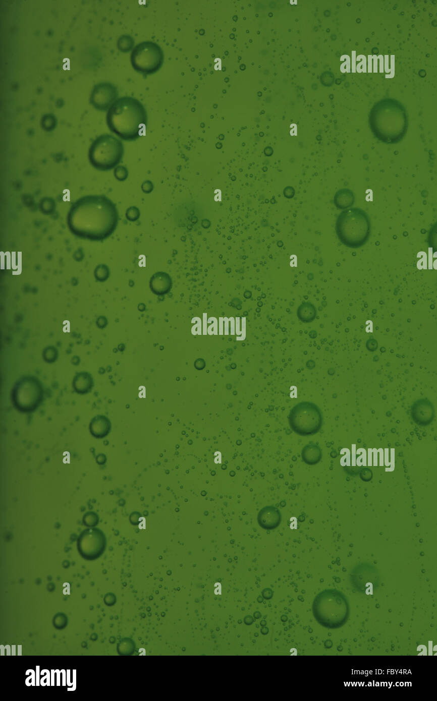 soap bubbles green liquid background Stock Photo - Alamy