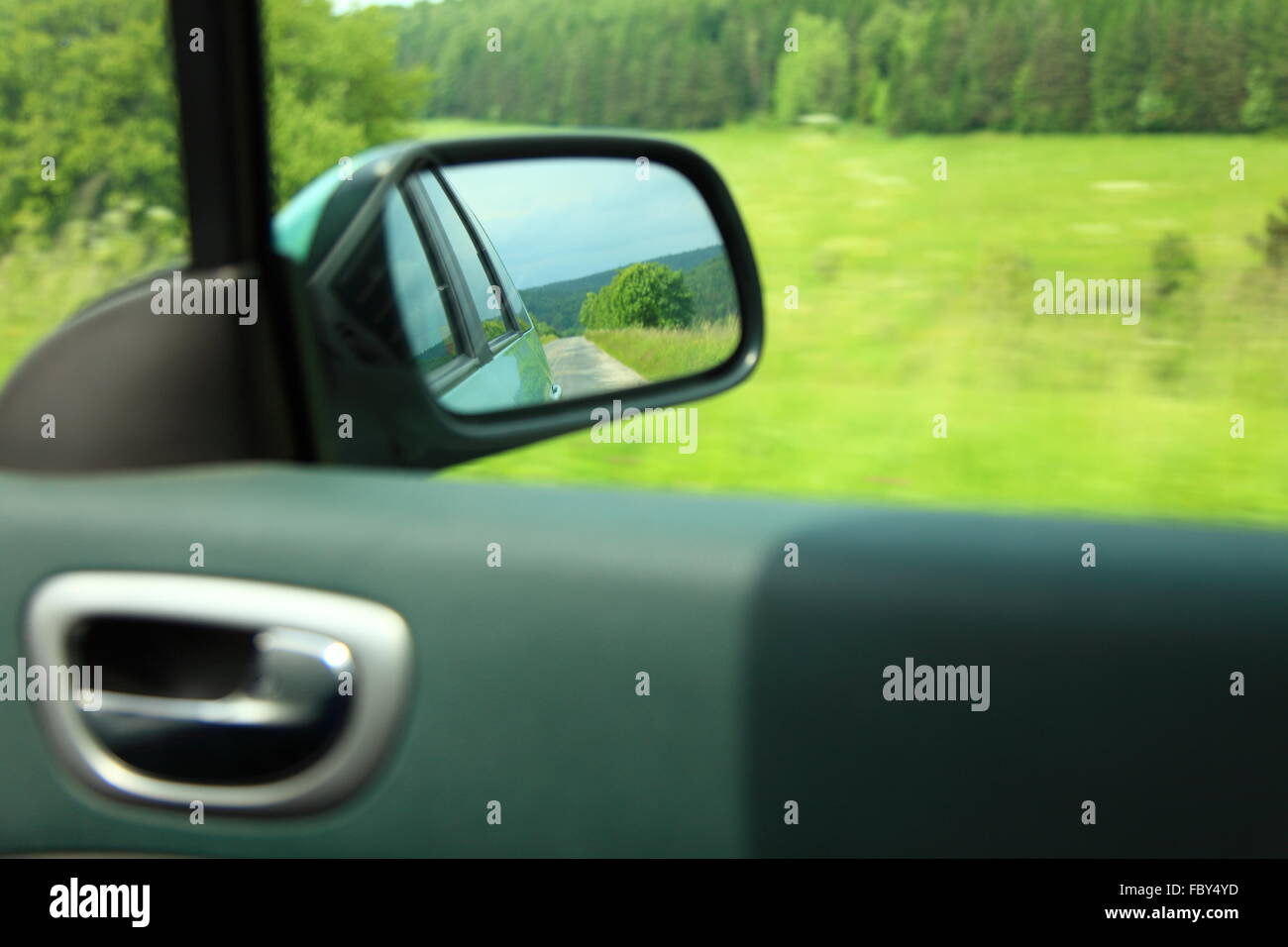 road car rear view mirror motion blur background Stock Photo - Alamy