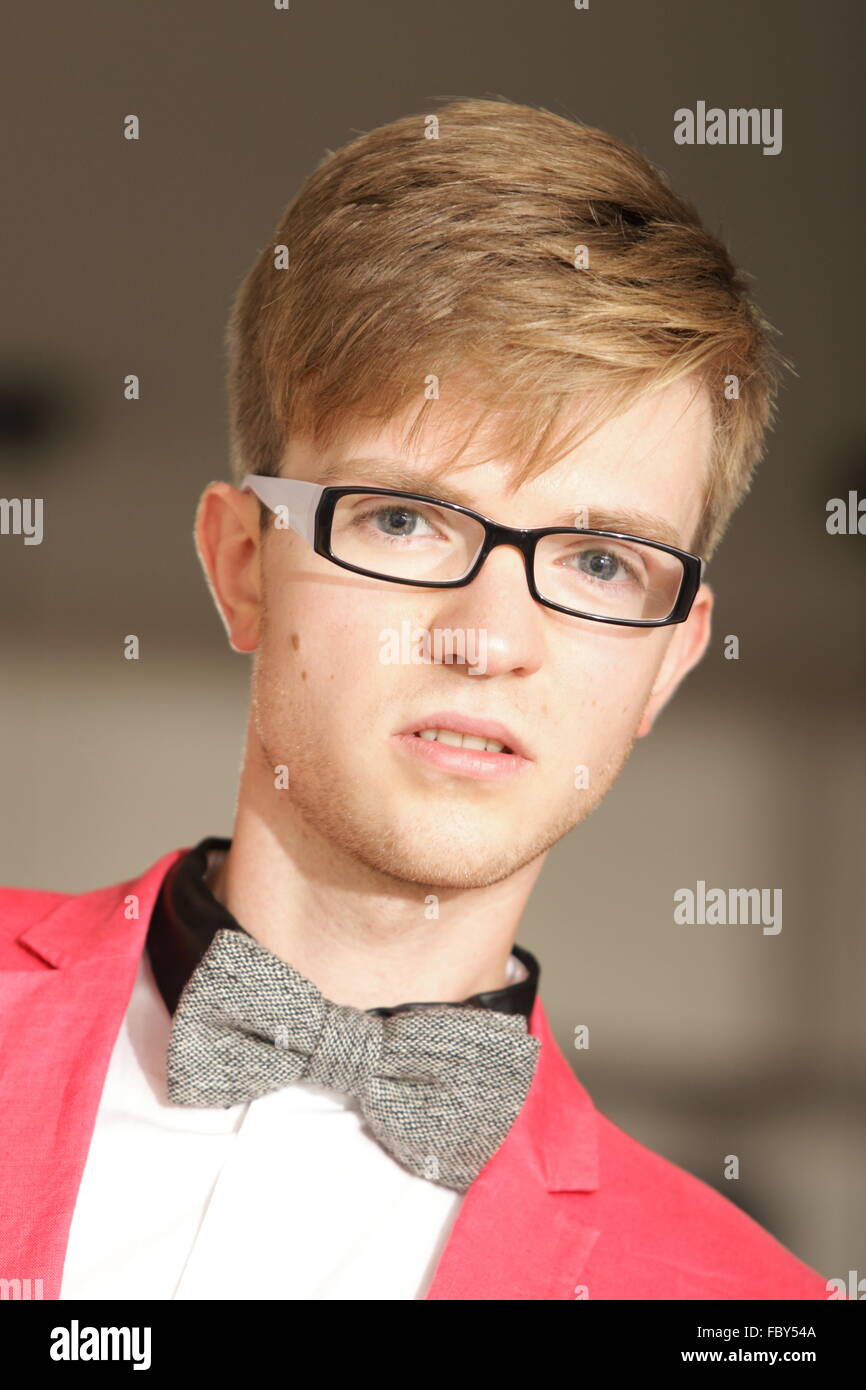 Young handsome stylish man posing indoor Stock Photo - Alamy