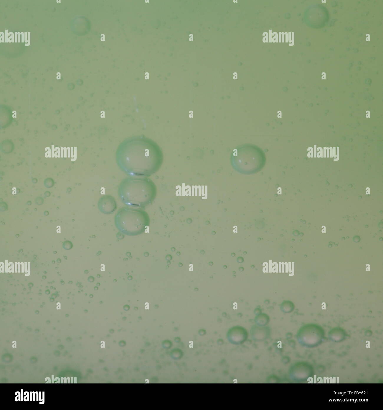 soap bubbles green liquid background Stock Photo - Alamy