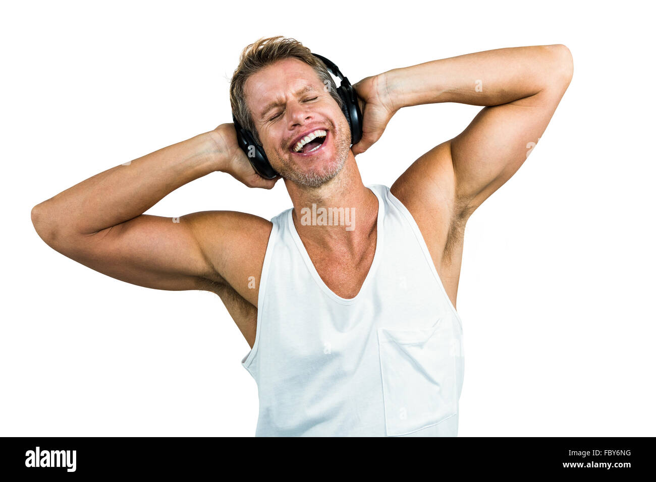 Happy man hearing music with headphones Stock Photo - Alamy