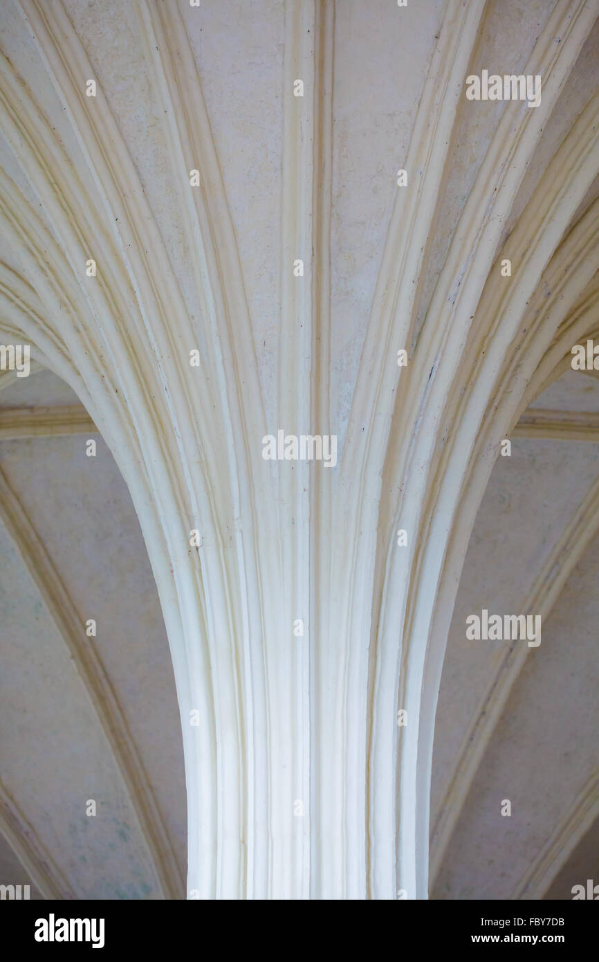Closeup white ceiling supported by old columns. Architectural part ...
