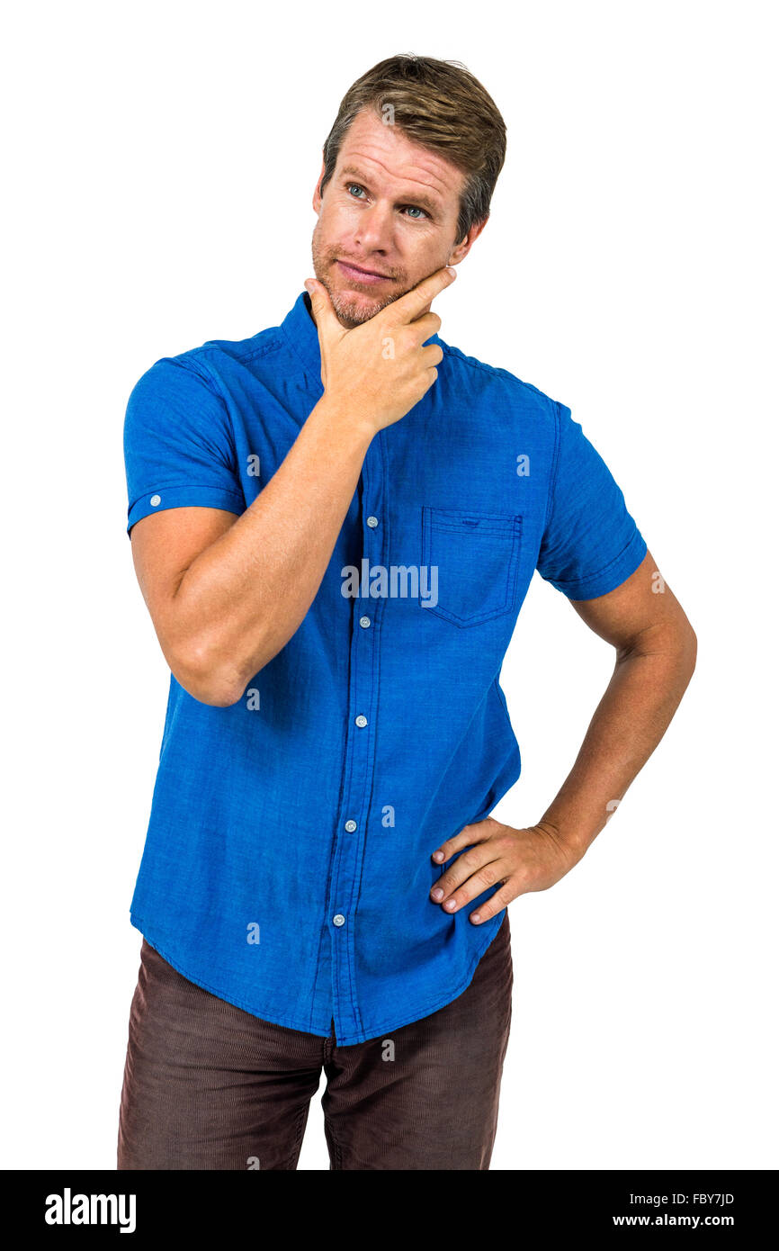 Contemplated man with hand on chin Stock Photo - Alamy