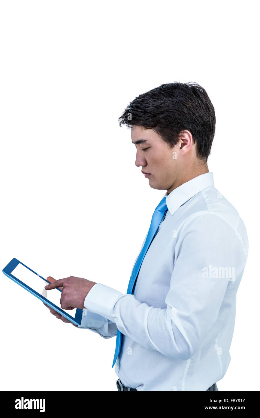 Serious asian businessman using his tablet Stock Photo - Alamy