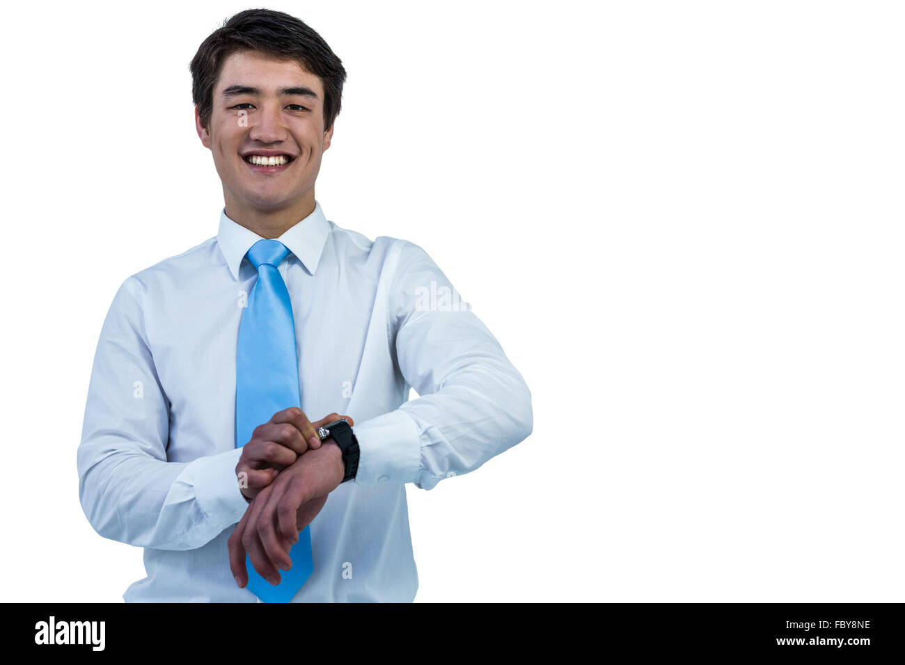 Smiling asian businessman holding his watch Stock Photo - Alamy