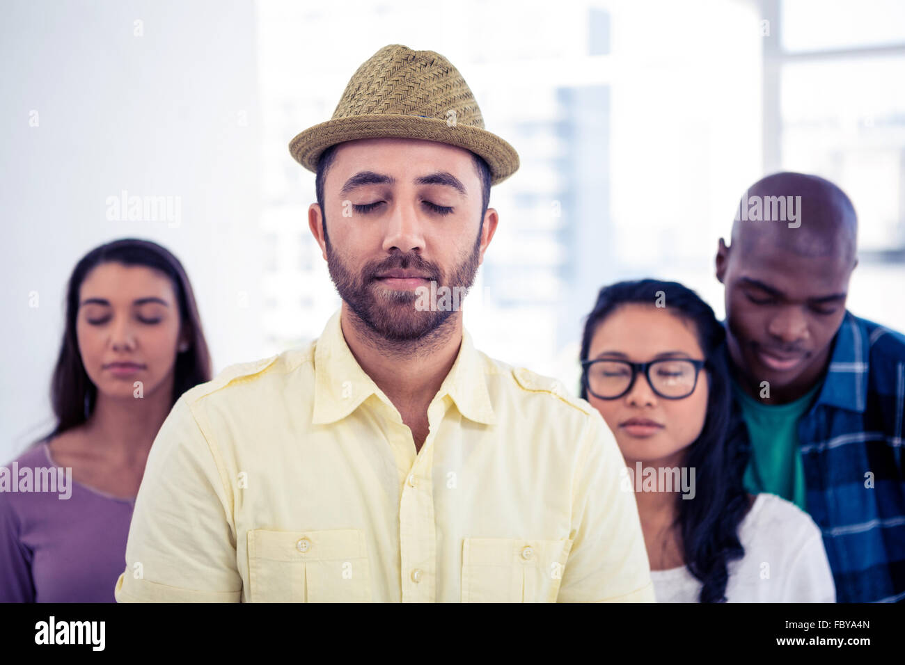 Young businessman with team relaxing Stock Photo - Alamy
