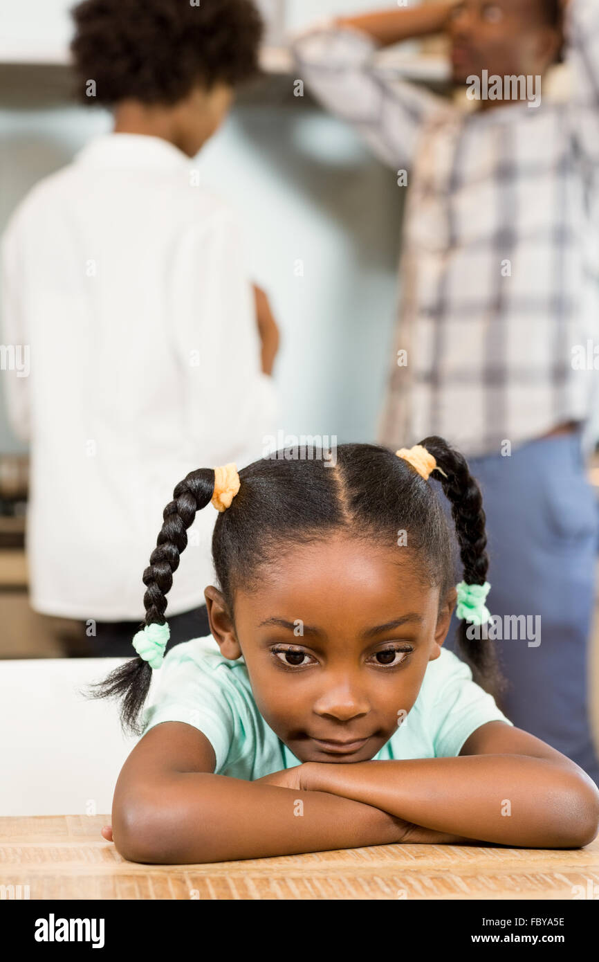 Sad girl against parents arguing Stock Photo - Alamy