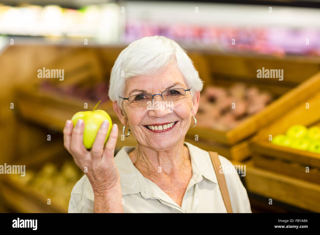 Woman watching green apple hi-res stock photography and images - Alamy