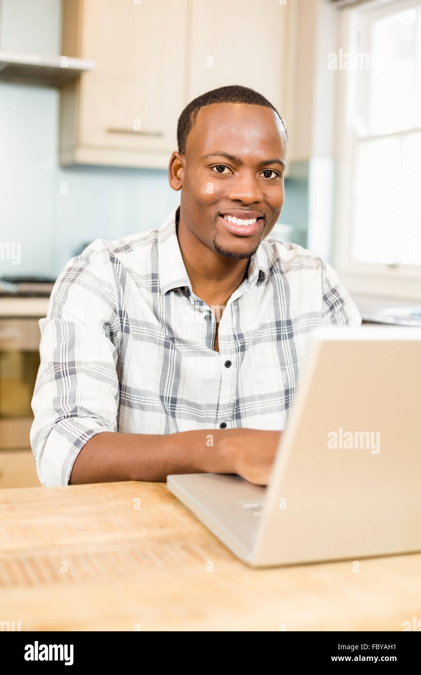 Handsome man using laptop Stock Photo - Alamy