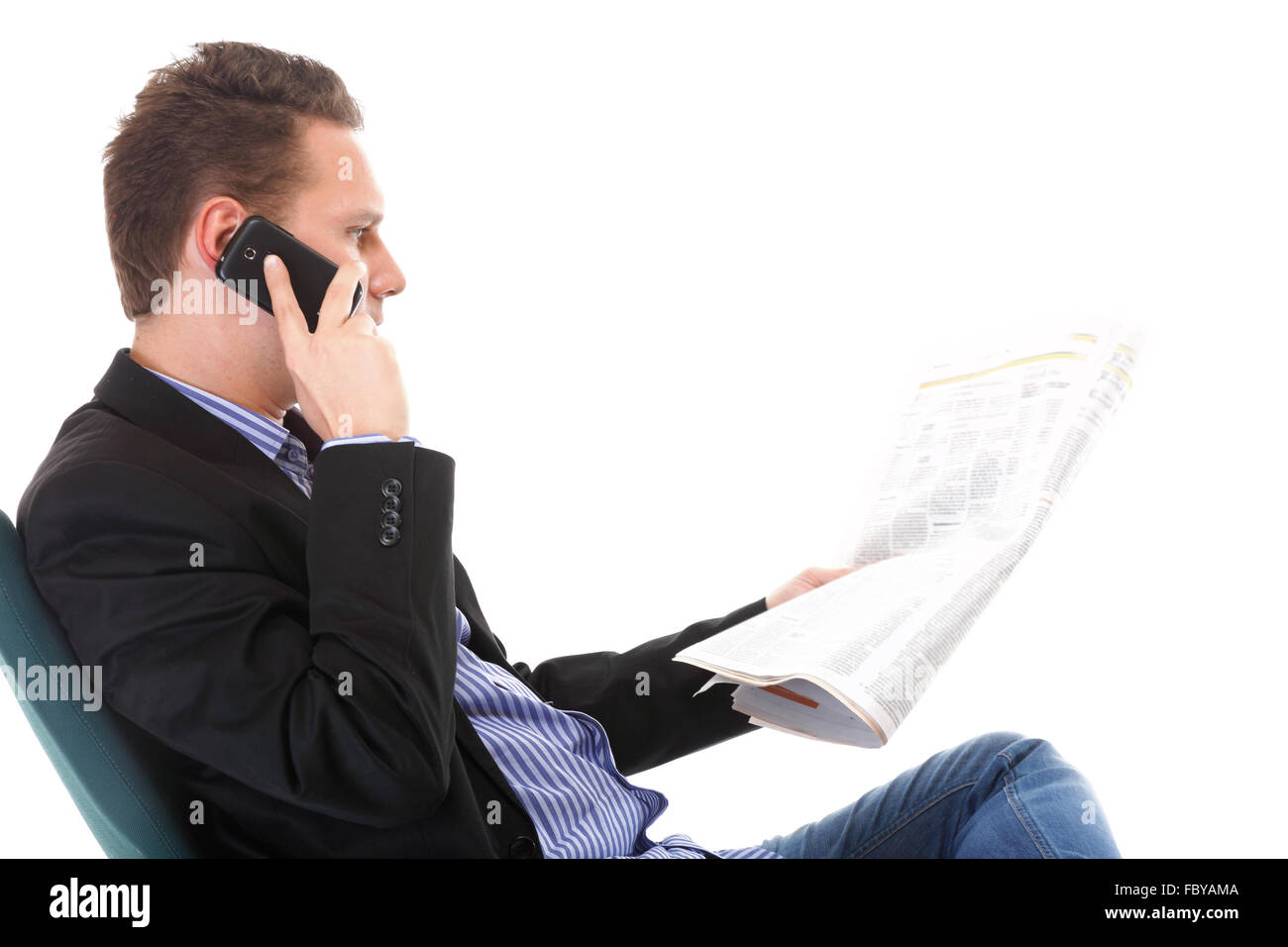 man reads newspaper phoning - economy news Stock Photo - Alamy
