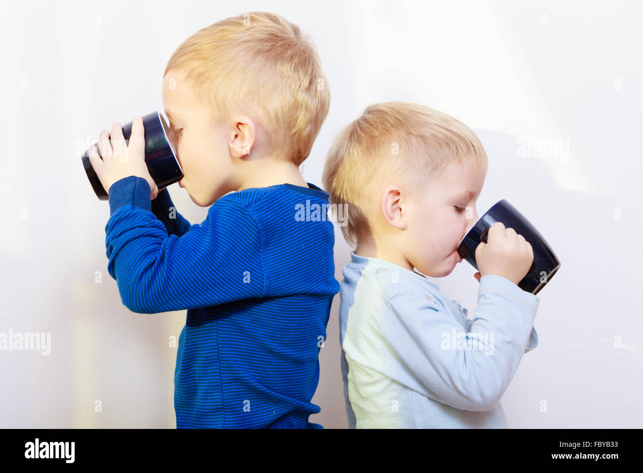 Little boy drinking tea hi-res stock photography and images - Alamy