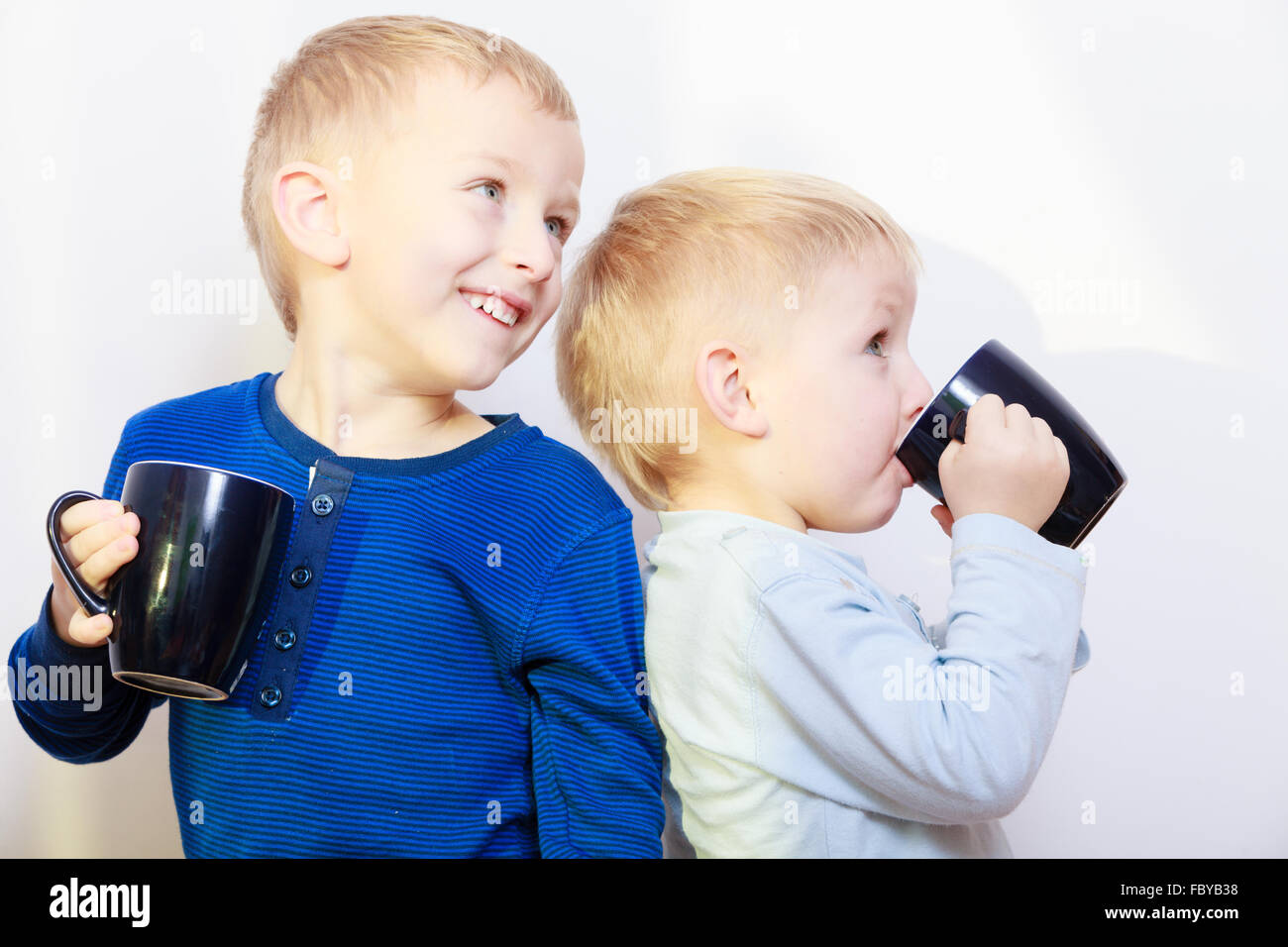 Little boy drinking tea hi-res stock photography and images - Alamy