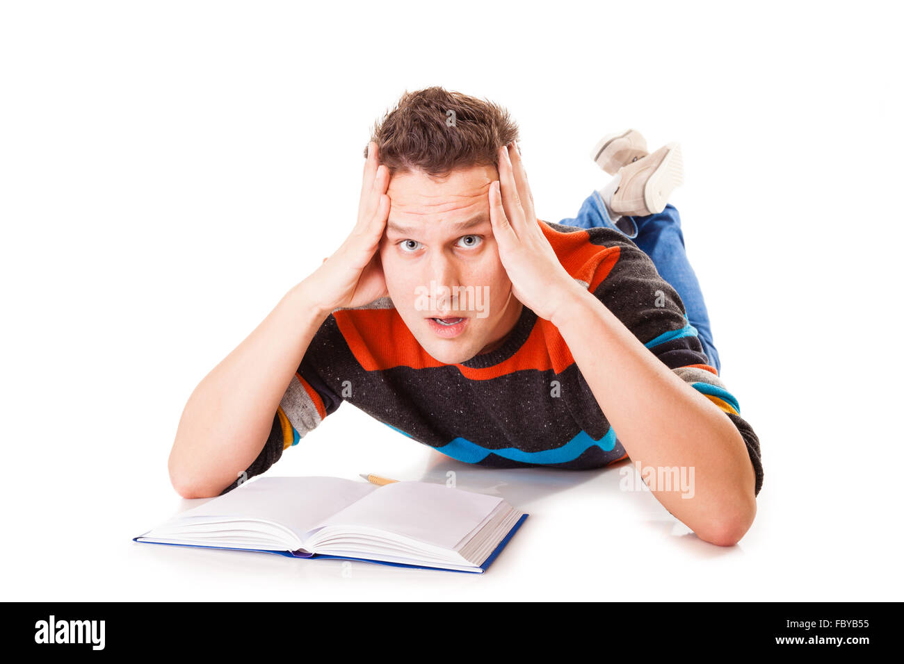 tired college student with book lying on floor preparing studying hard ...