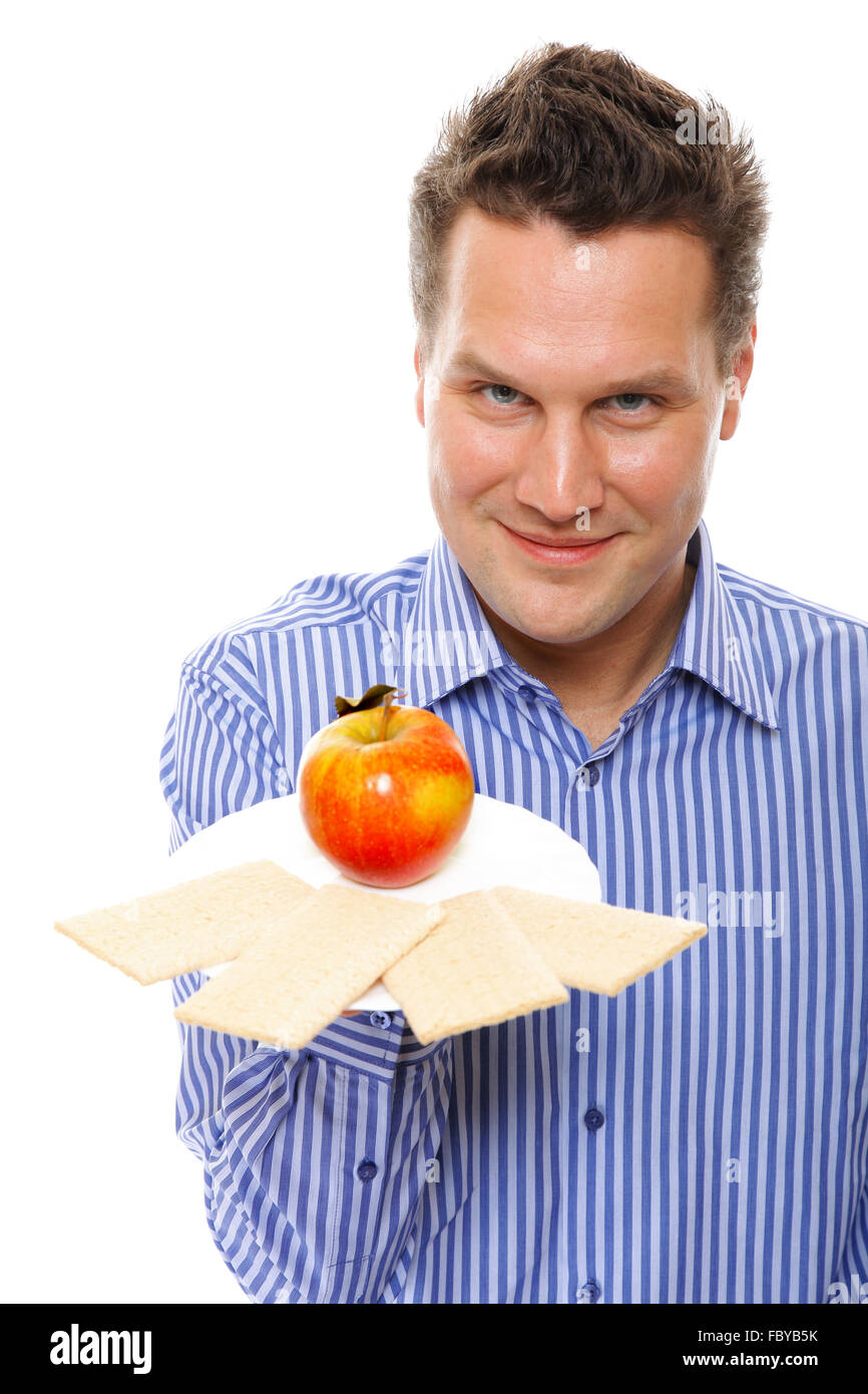 Healthy lifestyle man eating crispbread and apple Stock Photo - Alamy