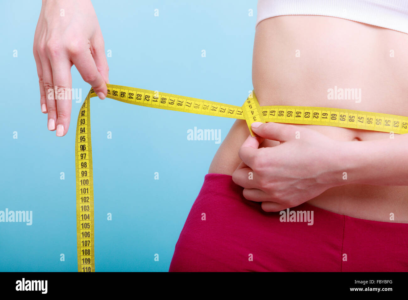 Woman and tape measure waist hi-res stock photography and images - Alamy