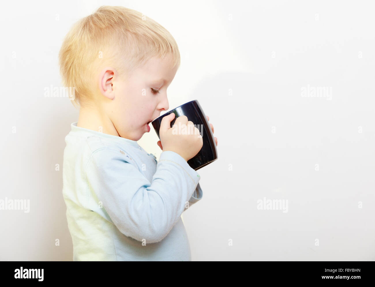 Little boy drinking tea hi-res stock photography and images - Alamy