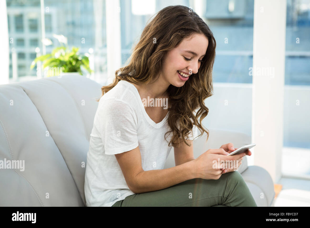Texting sofa hi-res stock photography and images - Alamy