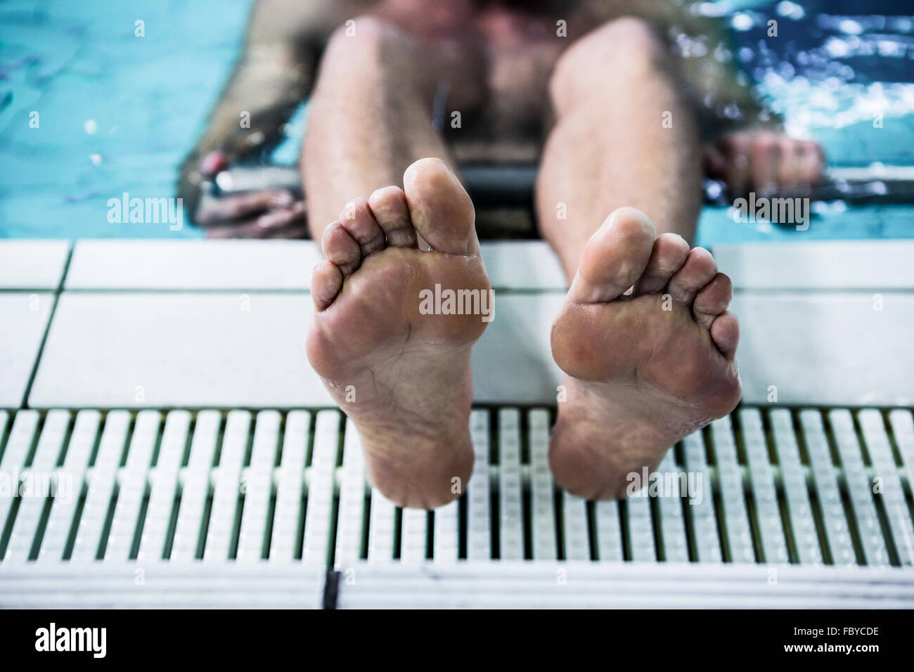 Swimmer foot on the edge of the swimming pool Stock Photo - Alamy
