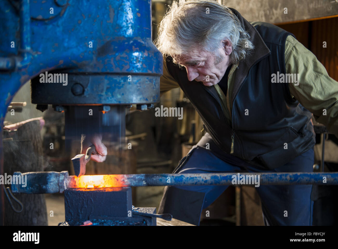 Blacksmith working on Electro Hammer Stock Photo - Alamy
