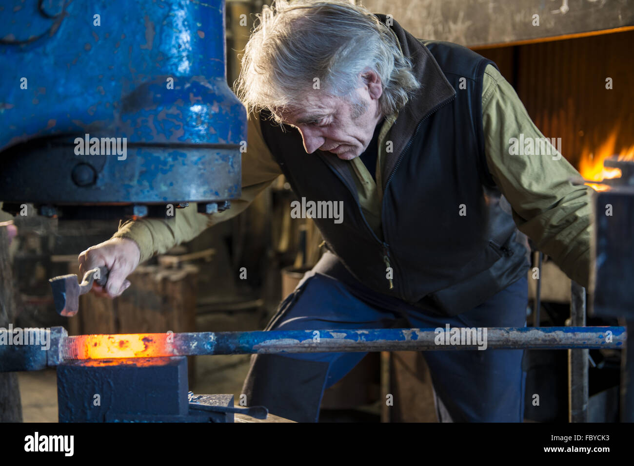 Blacksmith working on Electro Hammer Stock Photo - Alamy