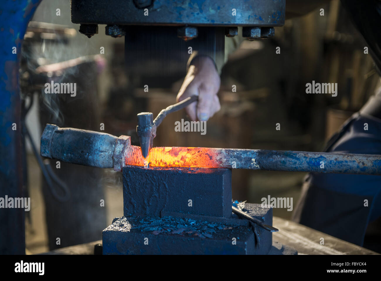 Blacksmith working on Electro Hammer Stock Photo - Alamy