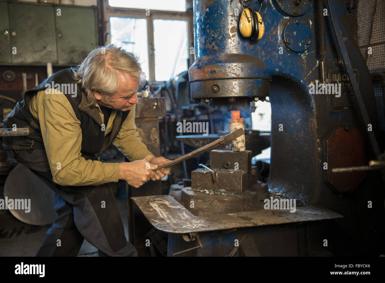 Blacksmith working on Electro Hammer Stock Photo - Alamy