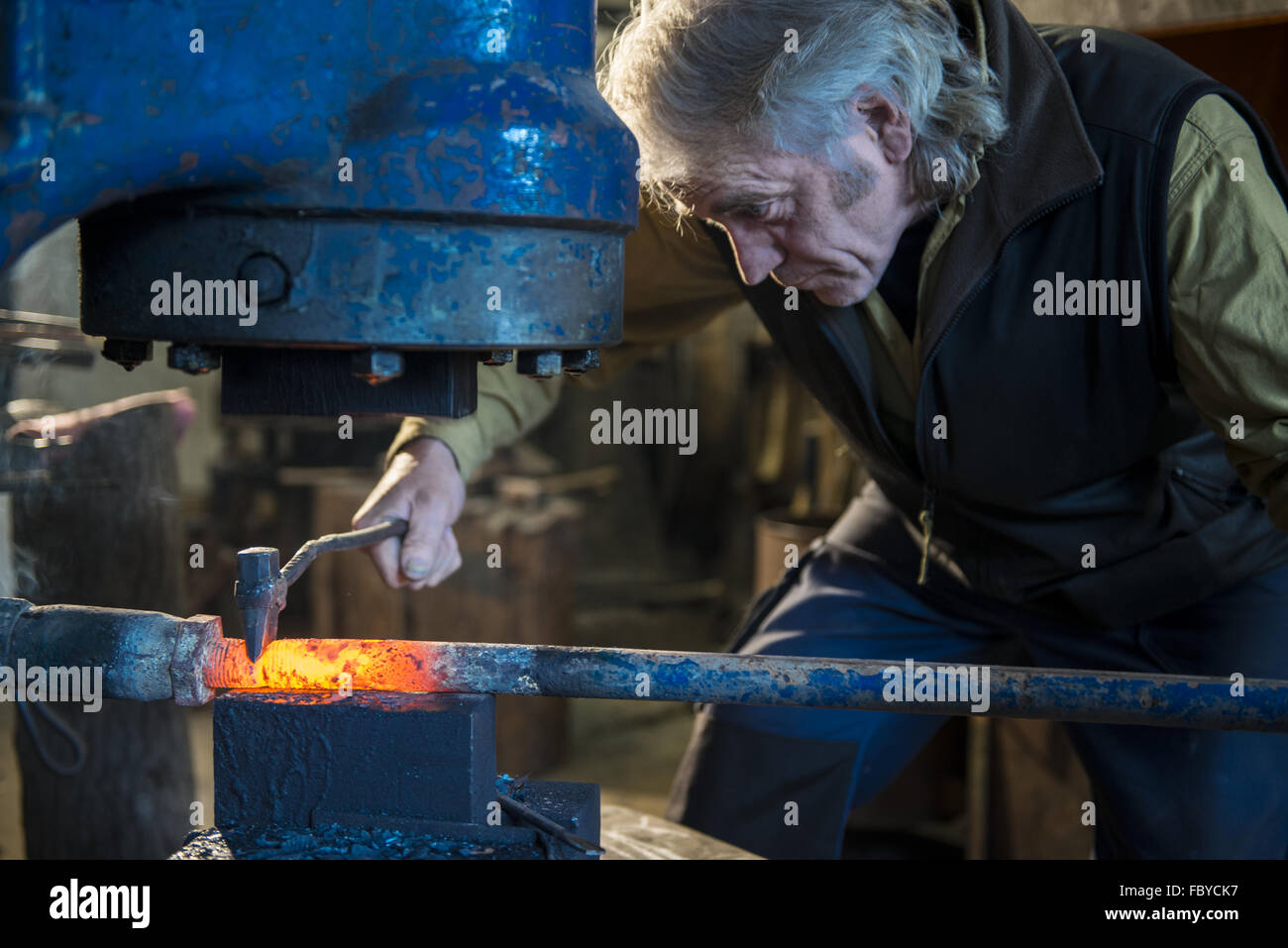 Blacksmith working on Electro Hammer Stock Photo - Alamy