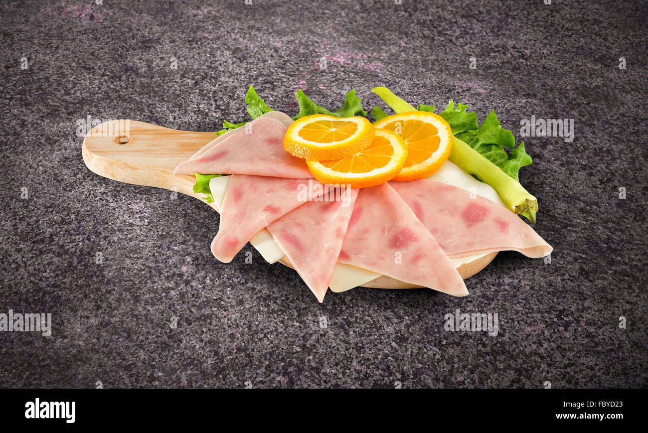 Pizza ham sliced on wooden board with clipping path Stock Photo - Alamy