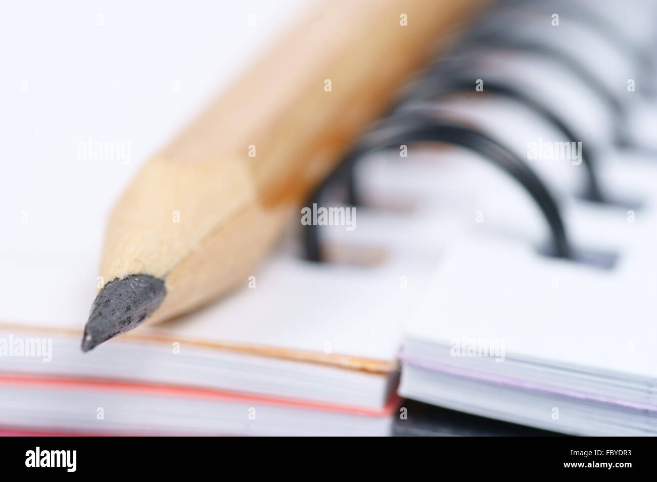 Notebook and pencil Stock Photo - Alamy