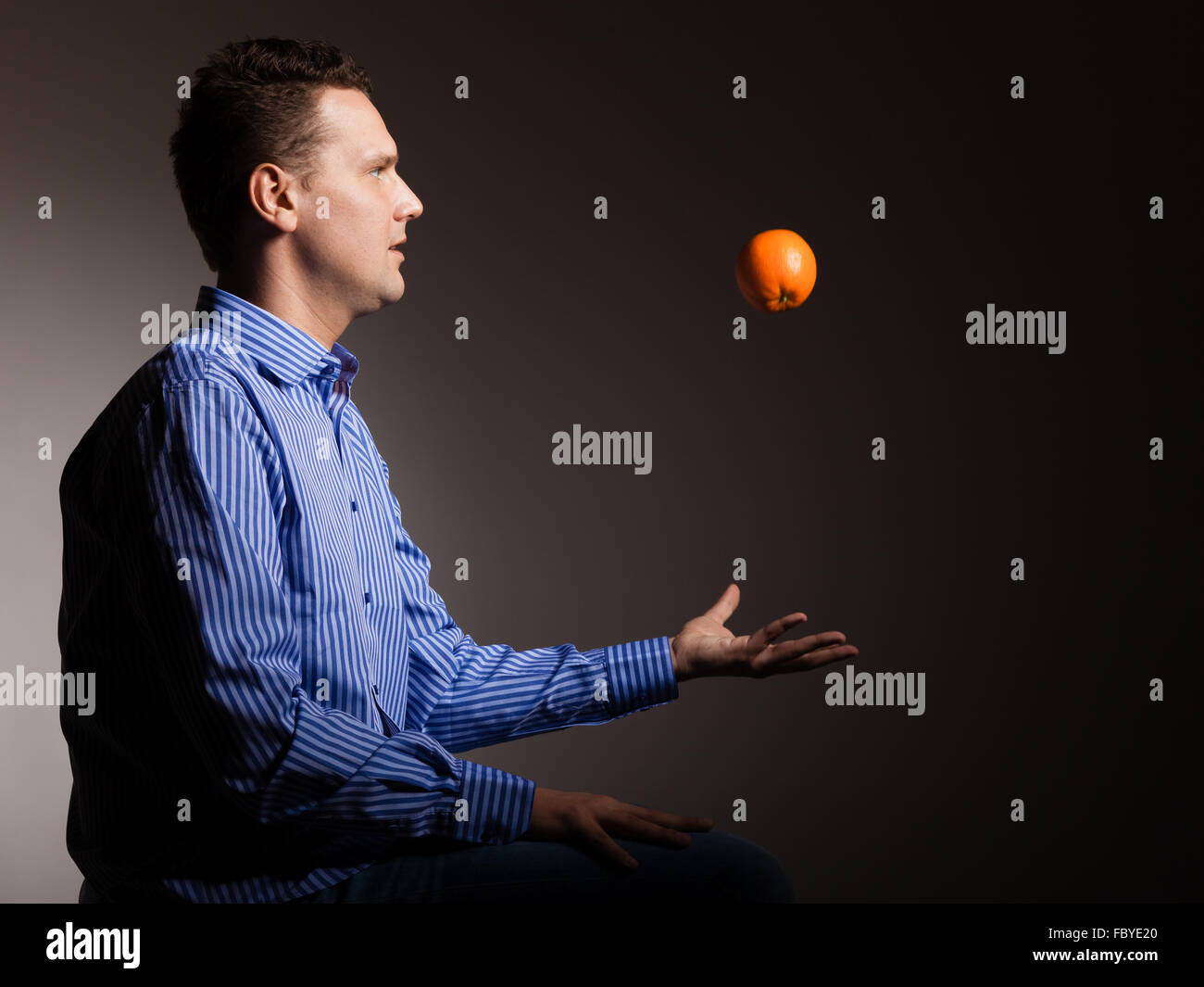 Tossing orange hi-res stock photography and images - Alamy
