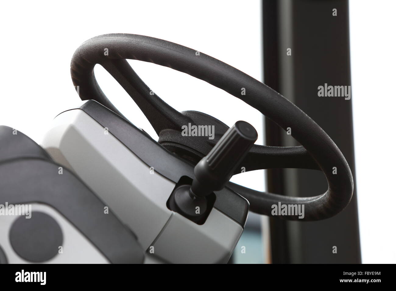 Steering wheel in new industrial machine Stock Photo - Alamy