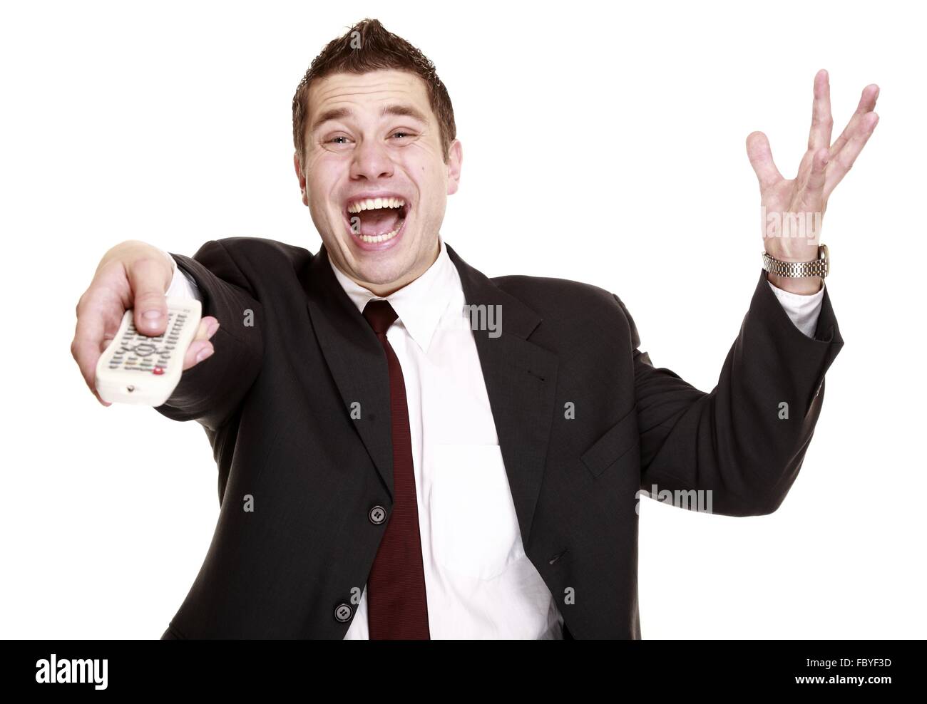 Crazy man with remote control changing channel Stock Photo - Alamy