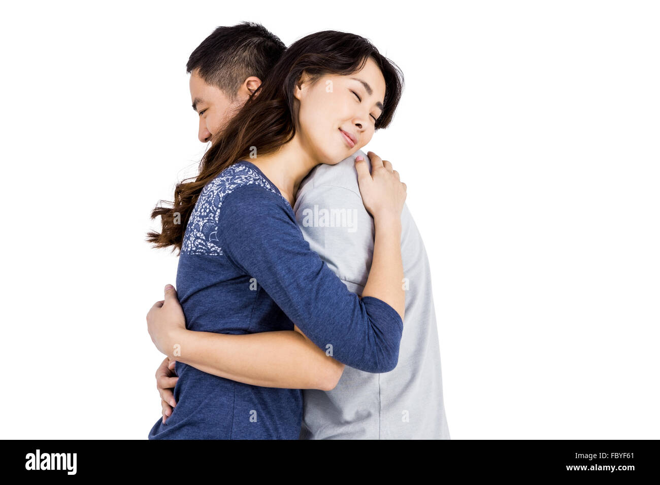 Happy couple embracing Stock Photo - Alamy
