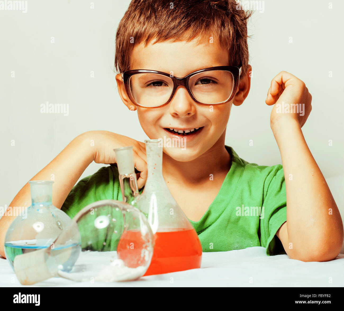 little cute boy with medicine glass isolated wearing glasses smiling ...