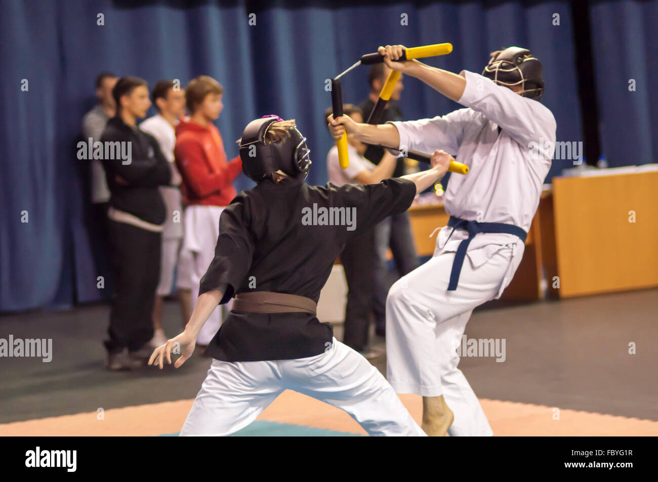 Kobudo competition men with nunchaku Stock Photo - Alamy