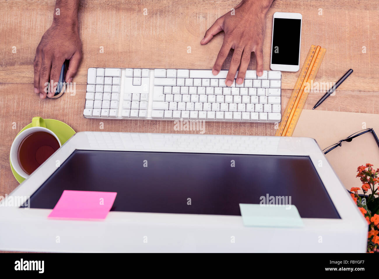 Cropped hand businessman working on computer at table Stock Photo - Alamy
