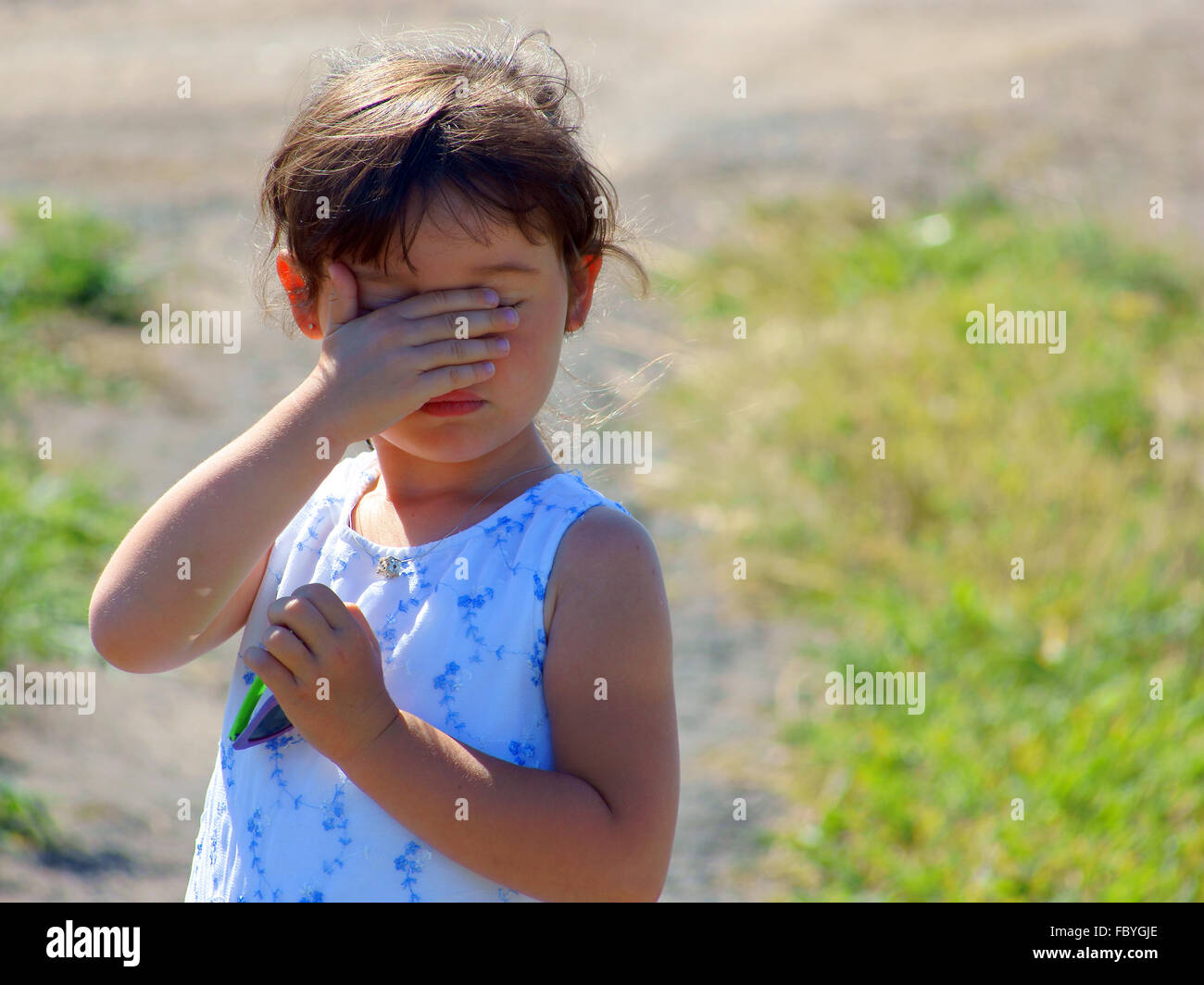 Little girl hiding Stock Photo - Alamy